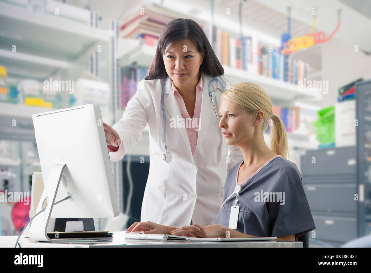 Doctor and nurse working at computer in hospital Stock Photo - Alamy
