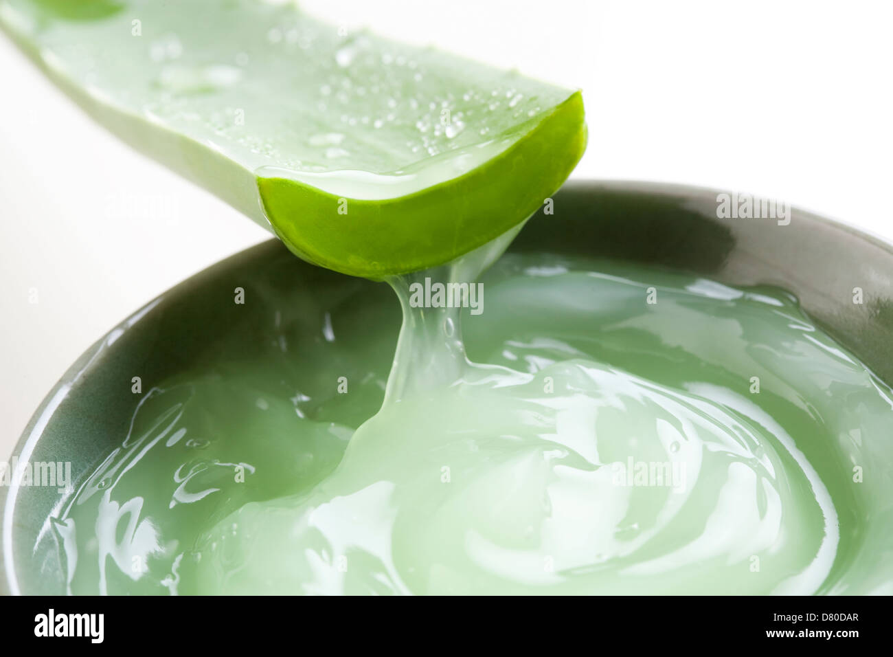 Aloe vera gel and fresh aloe leaf Stock Photo - Alamy