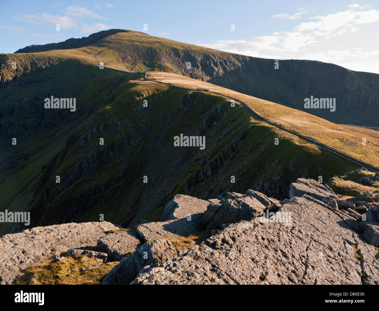 The summit of Snowdon in evening light, viewed across Cwm Glas Bach and ...