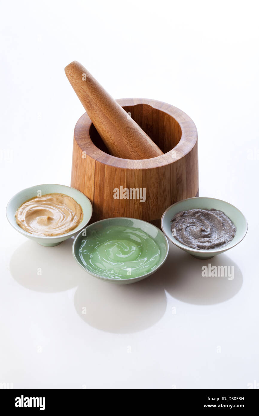 Facial care products with mortar-grinder Stock Photo - Alamy
