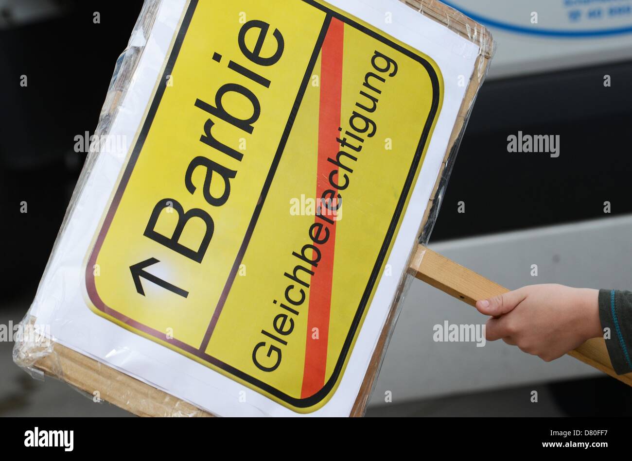 People protest during the opening of the Barbie Dreamhouse Experience ...