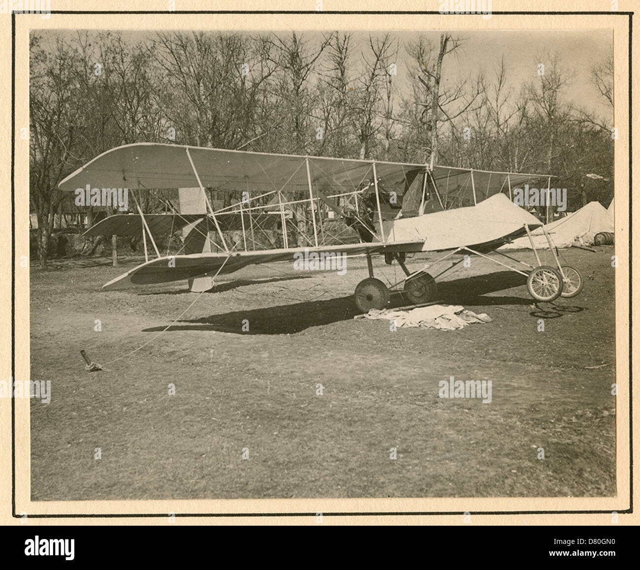 A biplane tethered to the ground during World War I, displaying the ...