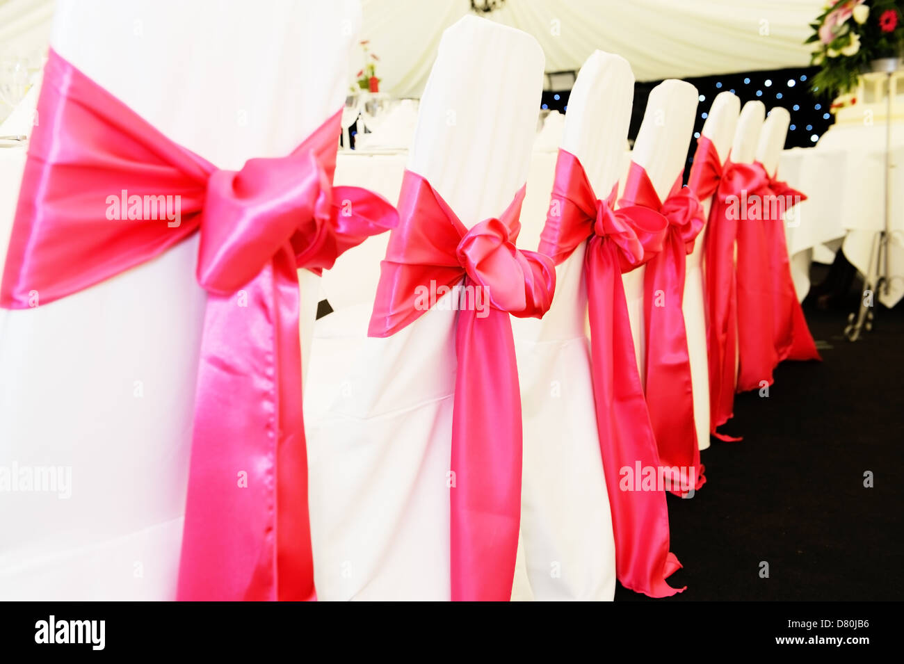Chairs at wedding reception with red ribbon and bows closeup Stock ...