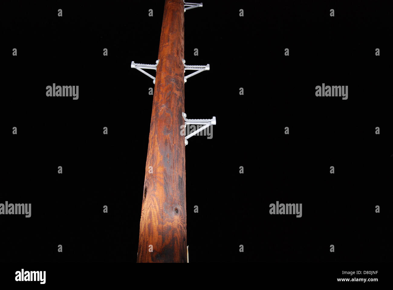 An electricity line post taken at night Stock Photo - Alamy