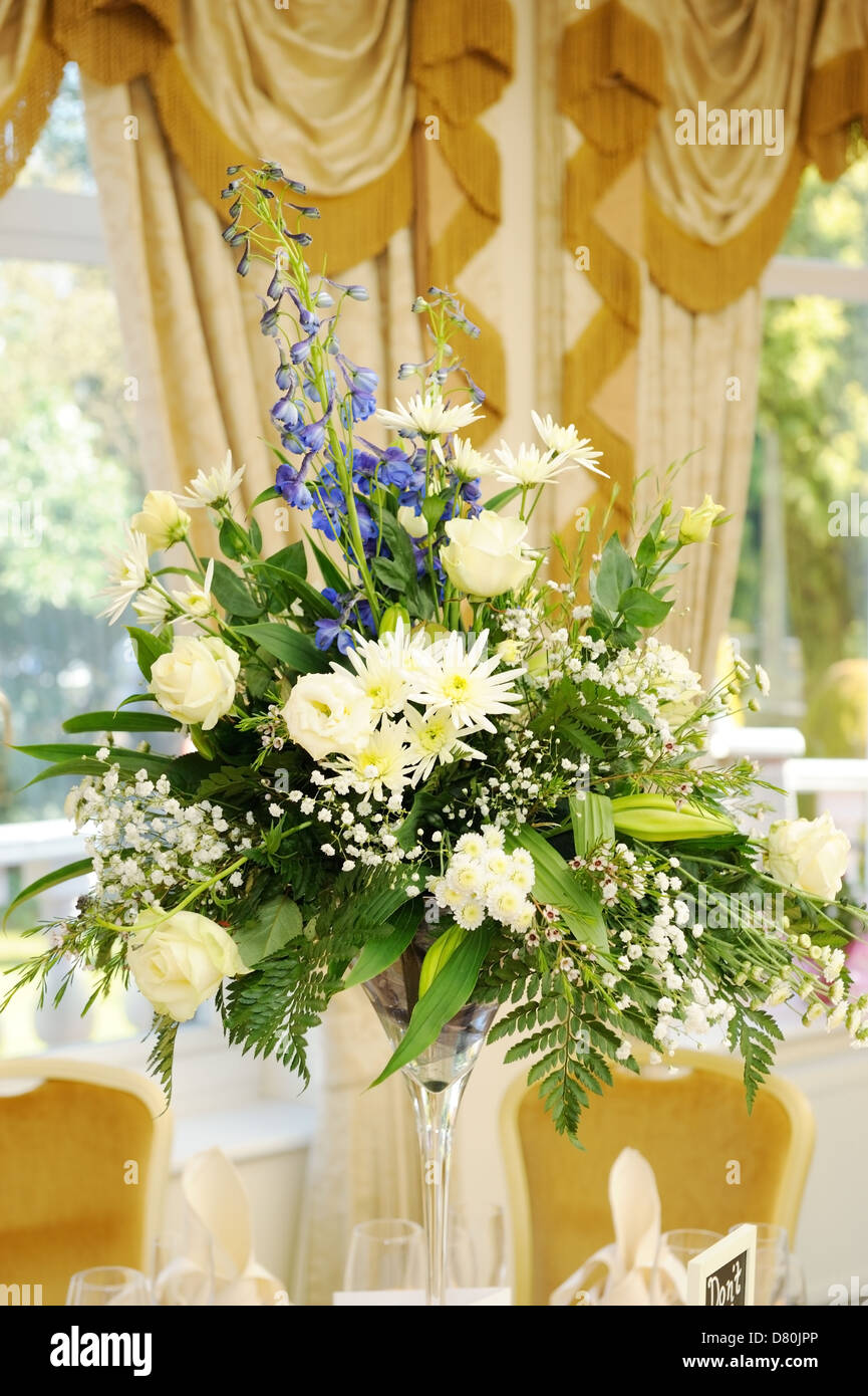 Flower arrangement decorates table at wedding reception Stock Photo - Alamy