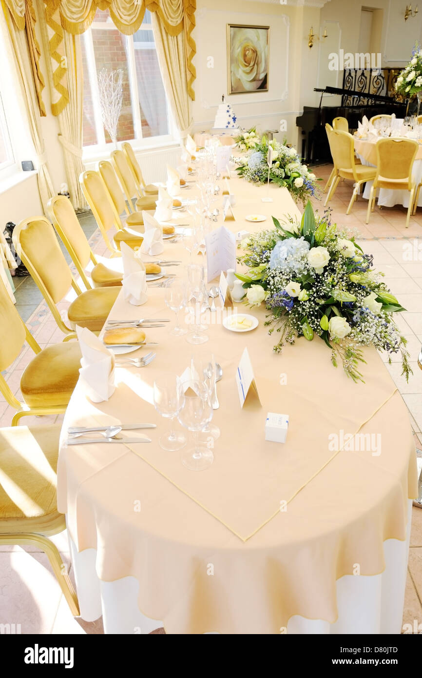 Top table at wedding reception decorated with flowers Stock Photo - Alamy