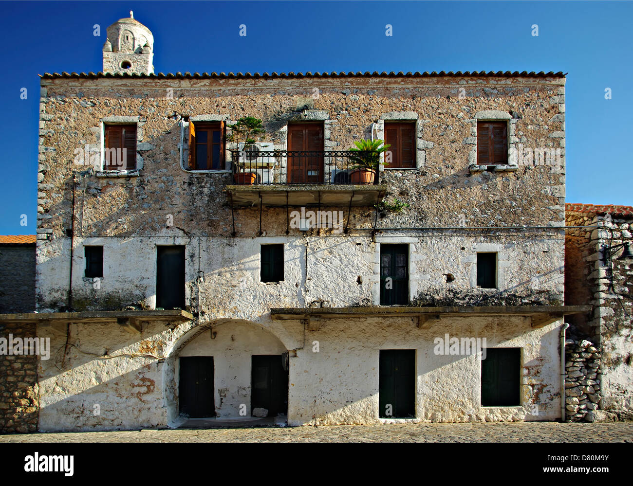 Typical Mediterranean stone house with balcony at sunny summer day ...