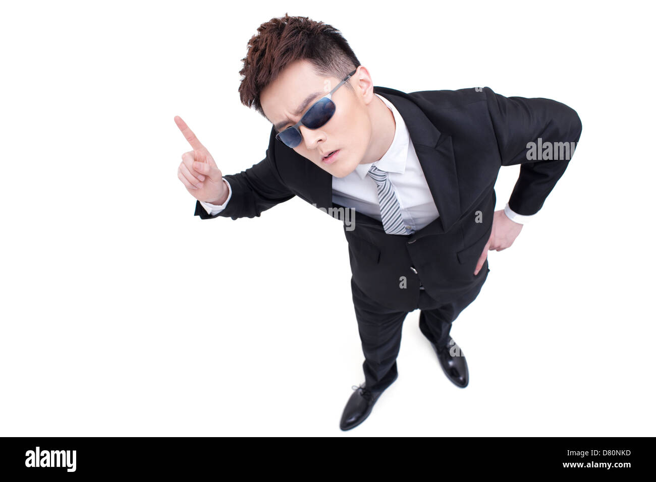Cool businessman raising finger up Stock Photo - Alamy