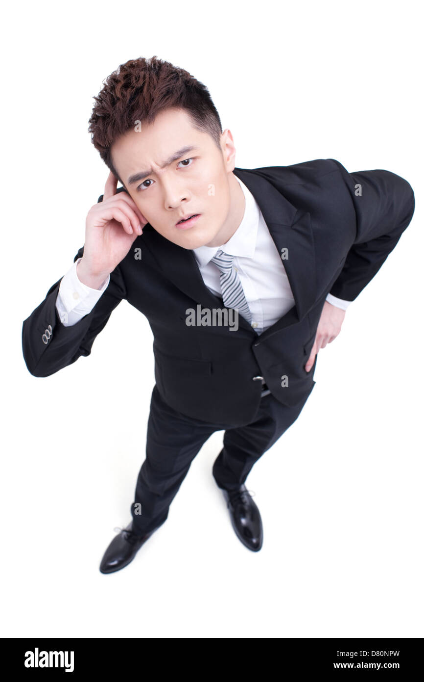 Young businessman showing a confused look Stock Photo - Alamy