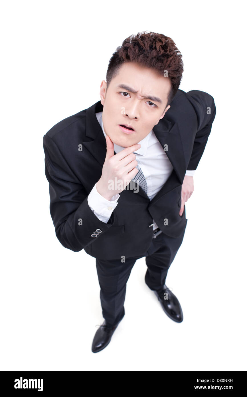 Young businessman showing a confused look Stock Photo - Alamy