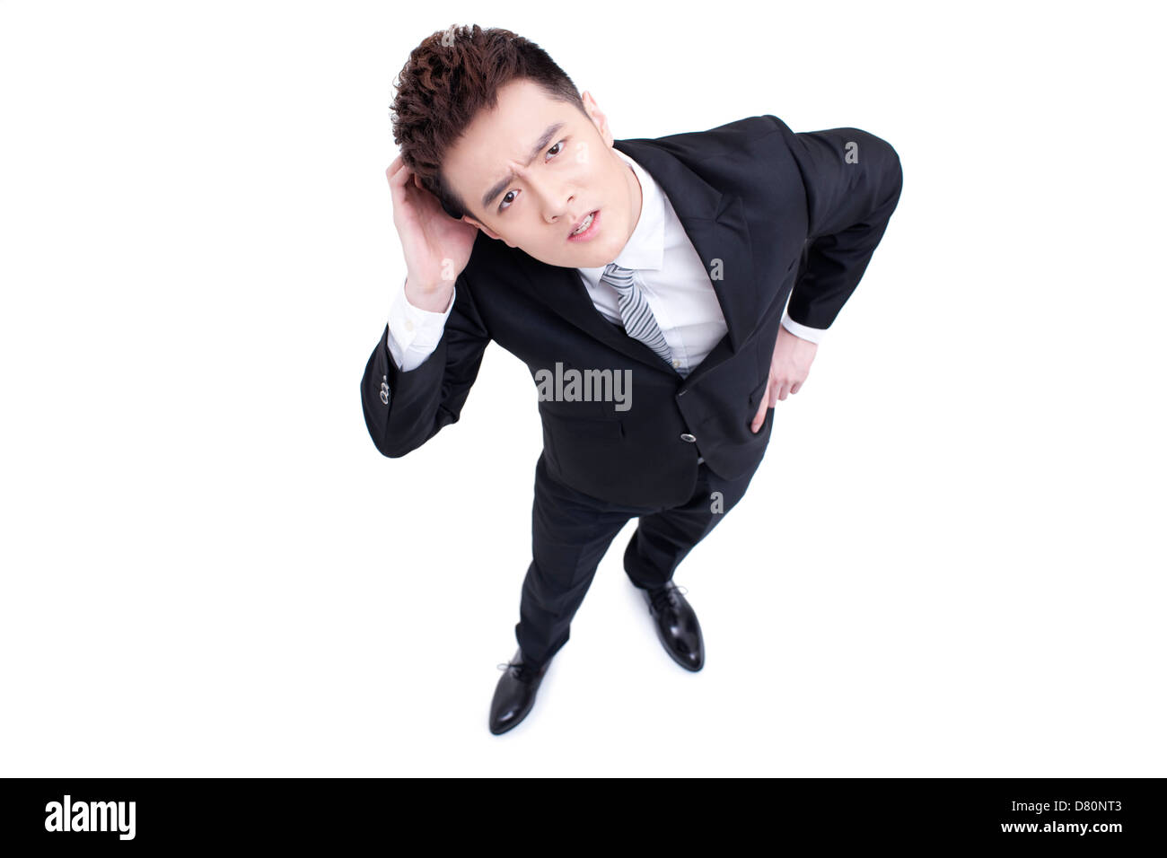 Young businessman showing a confused look Stock Photo - Alamy