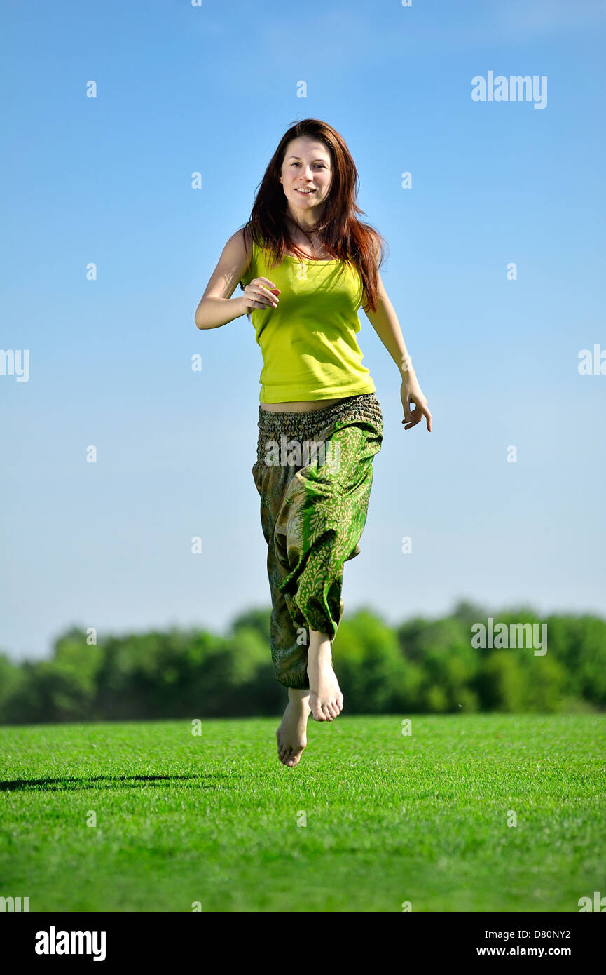 Beautiful young woman running barefoot hi-res stock photography and ...