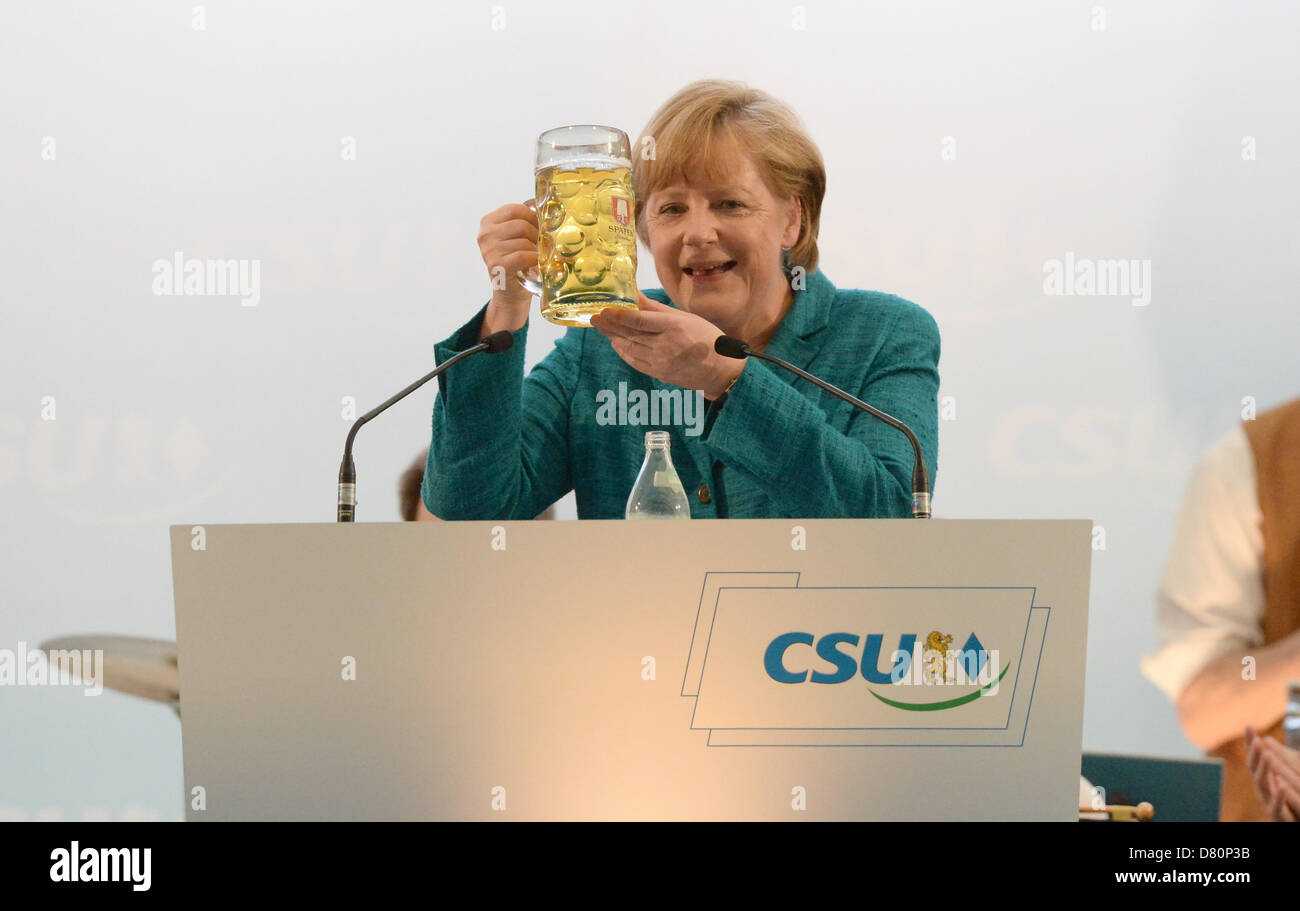 German Chancellor Angela Merkel toasts a mug of beer at the Truderinger ...