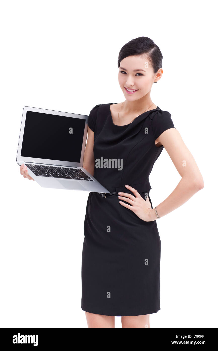 Fashionable businesswoman showing laptop Stock Photo - Alamy