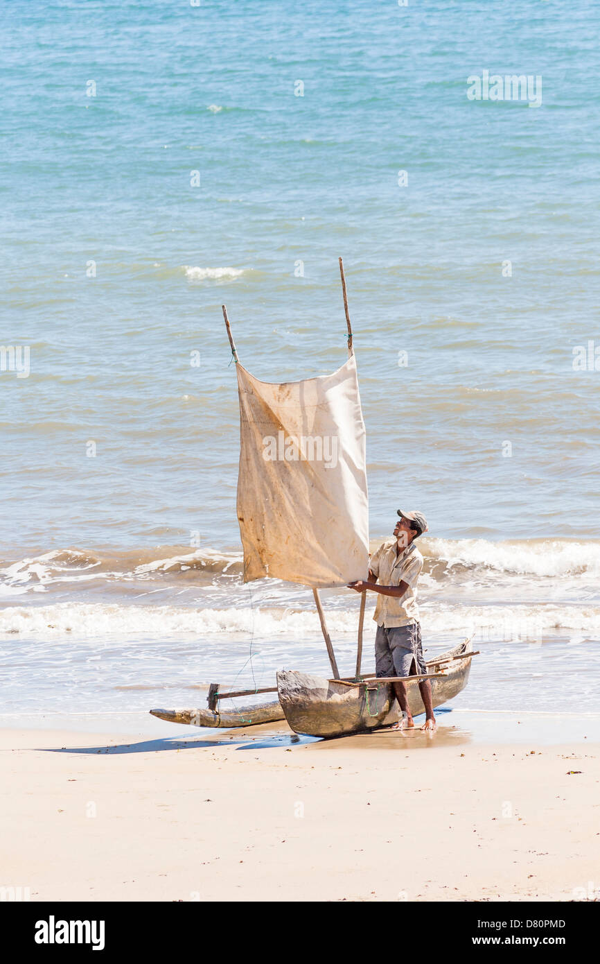 Nosy Be, Madagascar - fisherman with dug out canoe and primitive sail ...