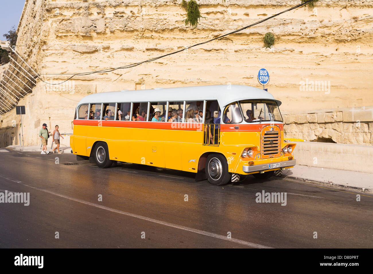 Yellow bus at Valletta Malta Stock Photo - Alamy