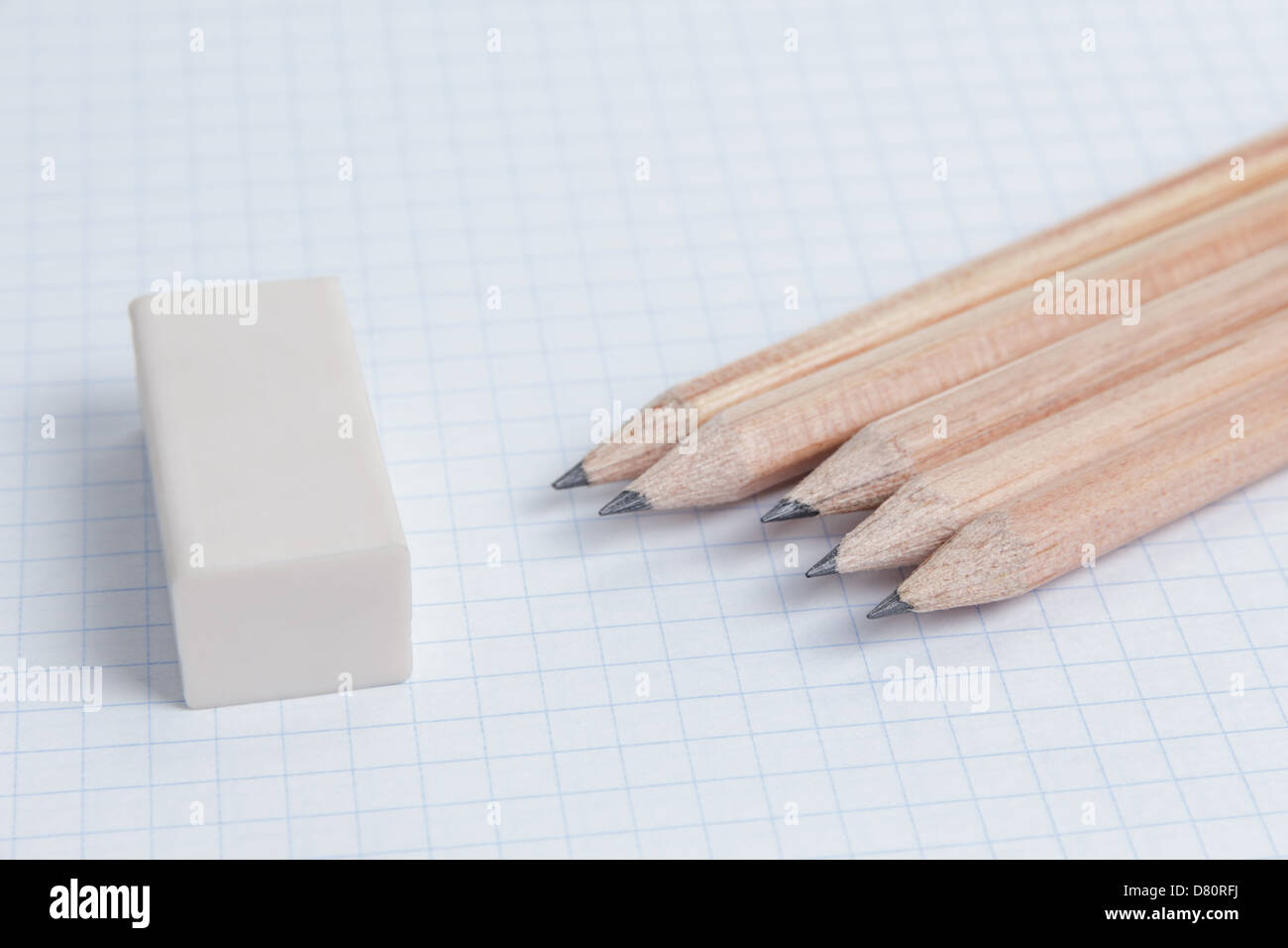 pencils and eraser on notebook page, school or business background ...