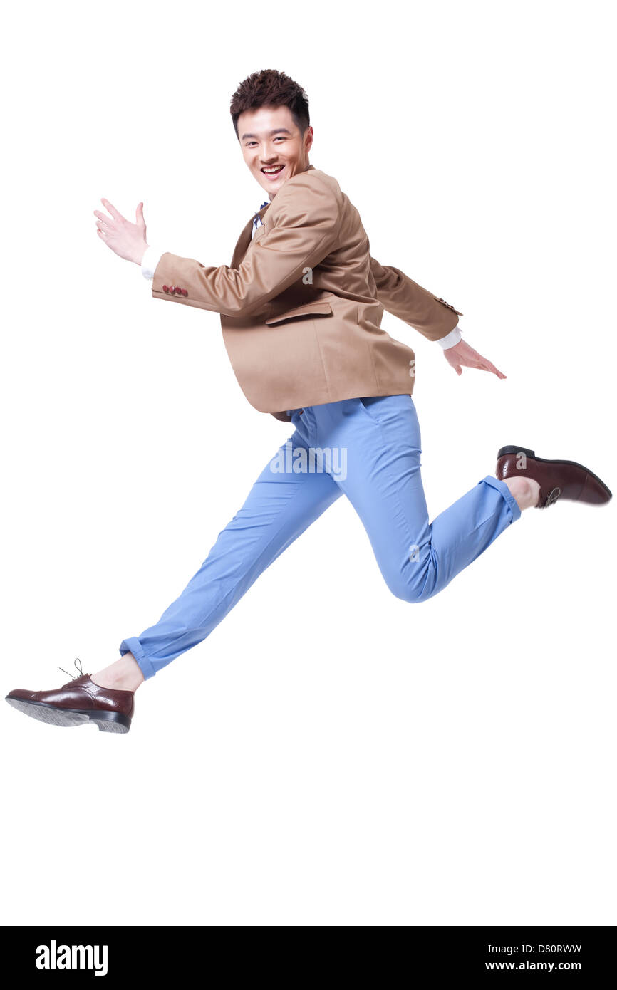 Stylish businessman jumping with excitement Stock Photo - Alamy