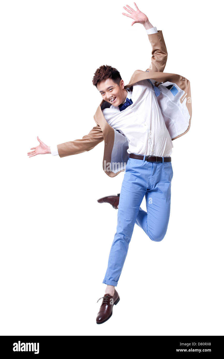 Stylish businessman jumping with excitement Stock Photo - Alamy