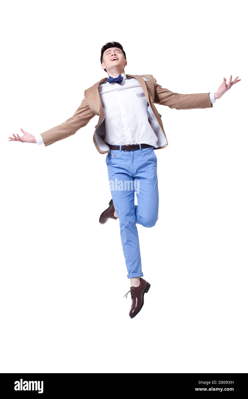 Stylish businessman jumping with excitement Stock Photo - Alamy