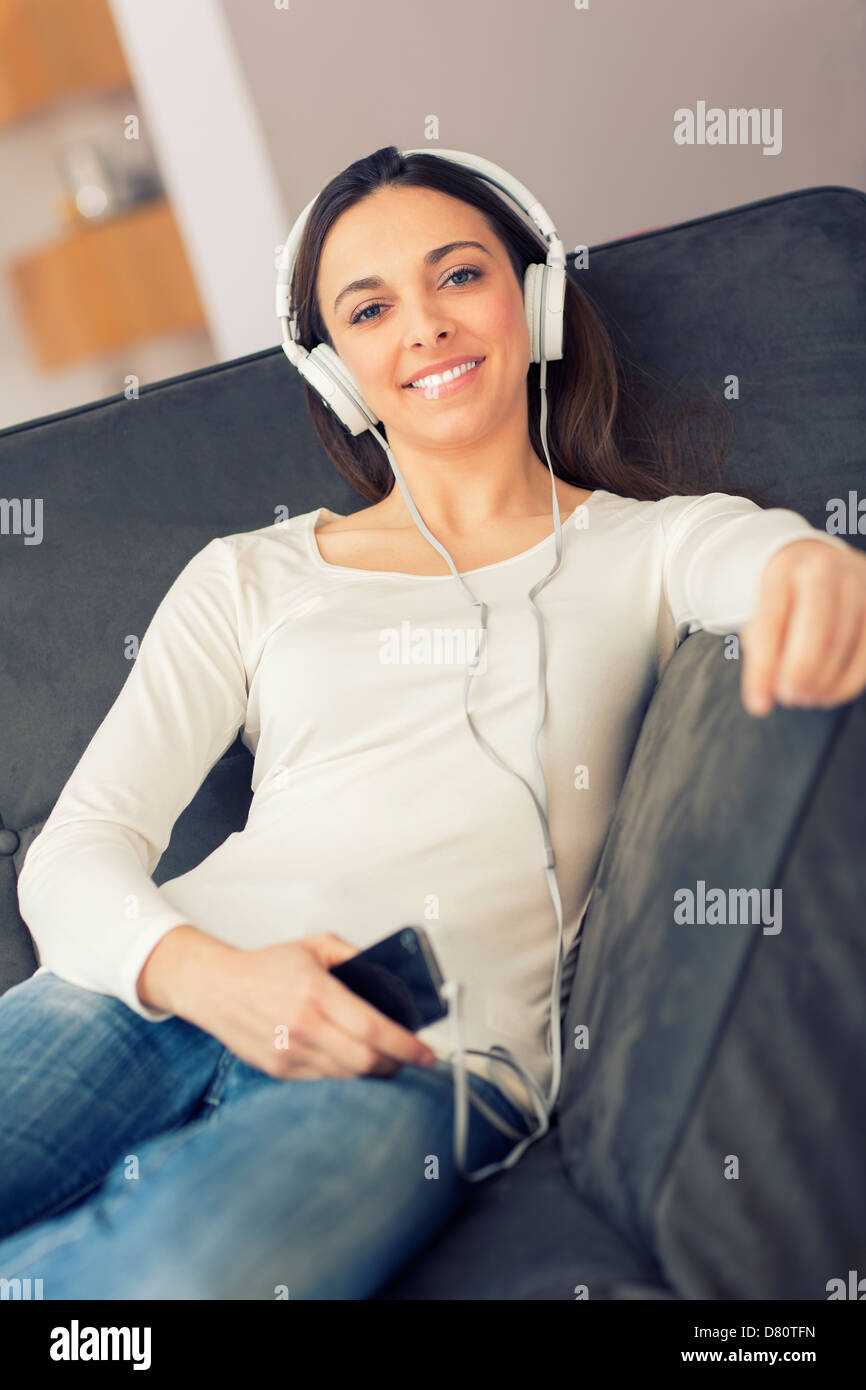 Portrait of simling female whit her headphones Stock Photo - Alamy
