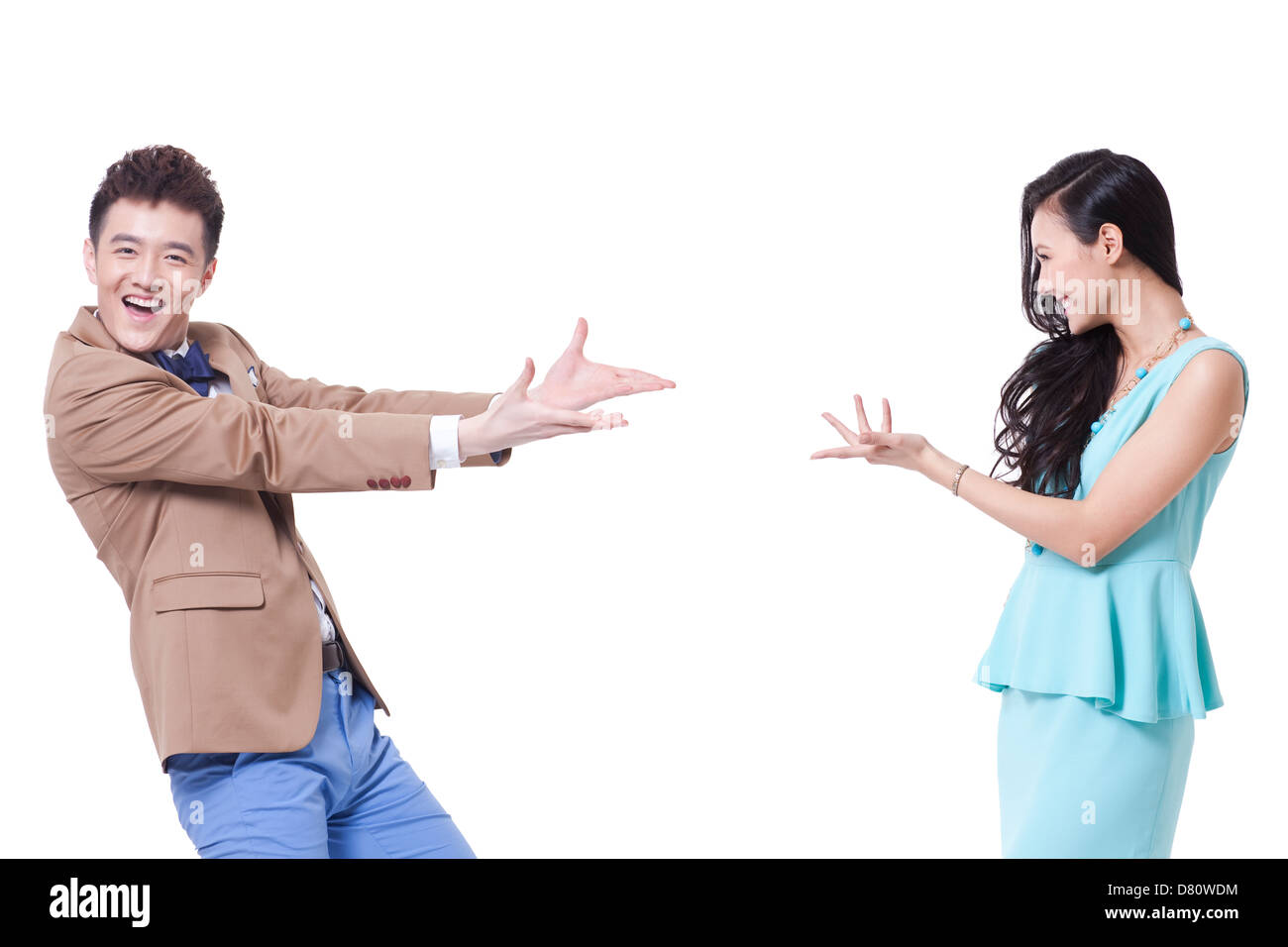 Cheerful young man presenting side Cut Out Stock Images & Pictures - Alamy
