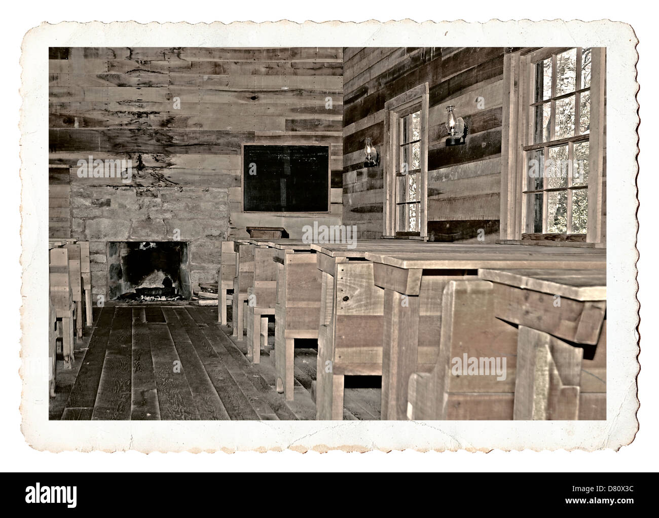 Interior of a vintage schoolhouse with desks and a fireplace Stock ...