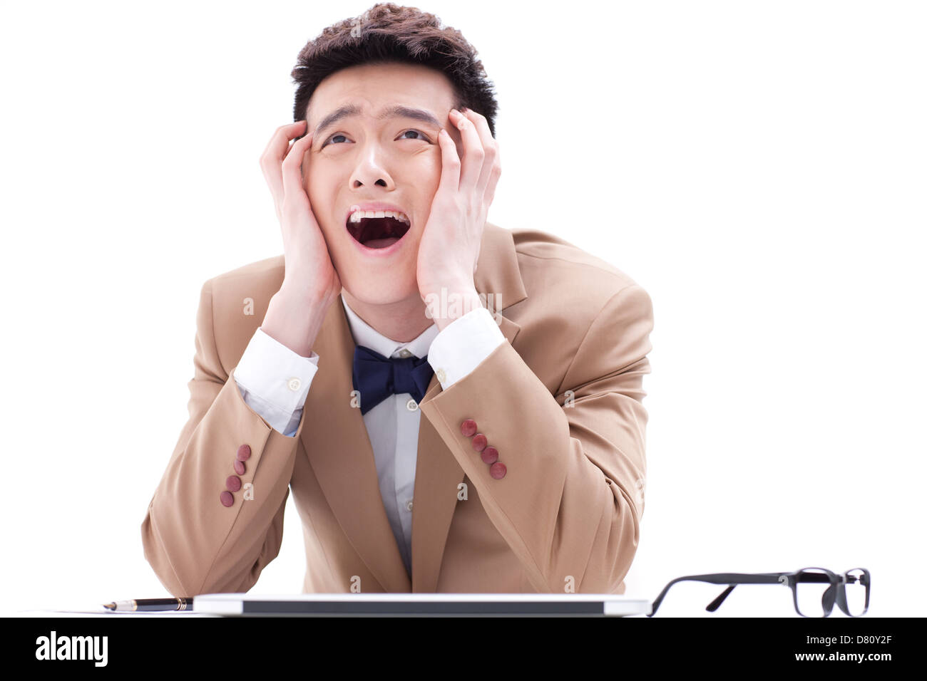 Frustrated young businessman shouting Stock Photo - Alamy