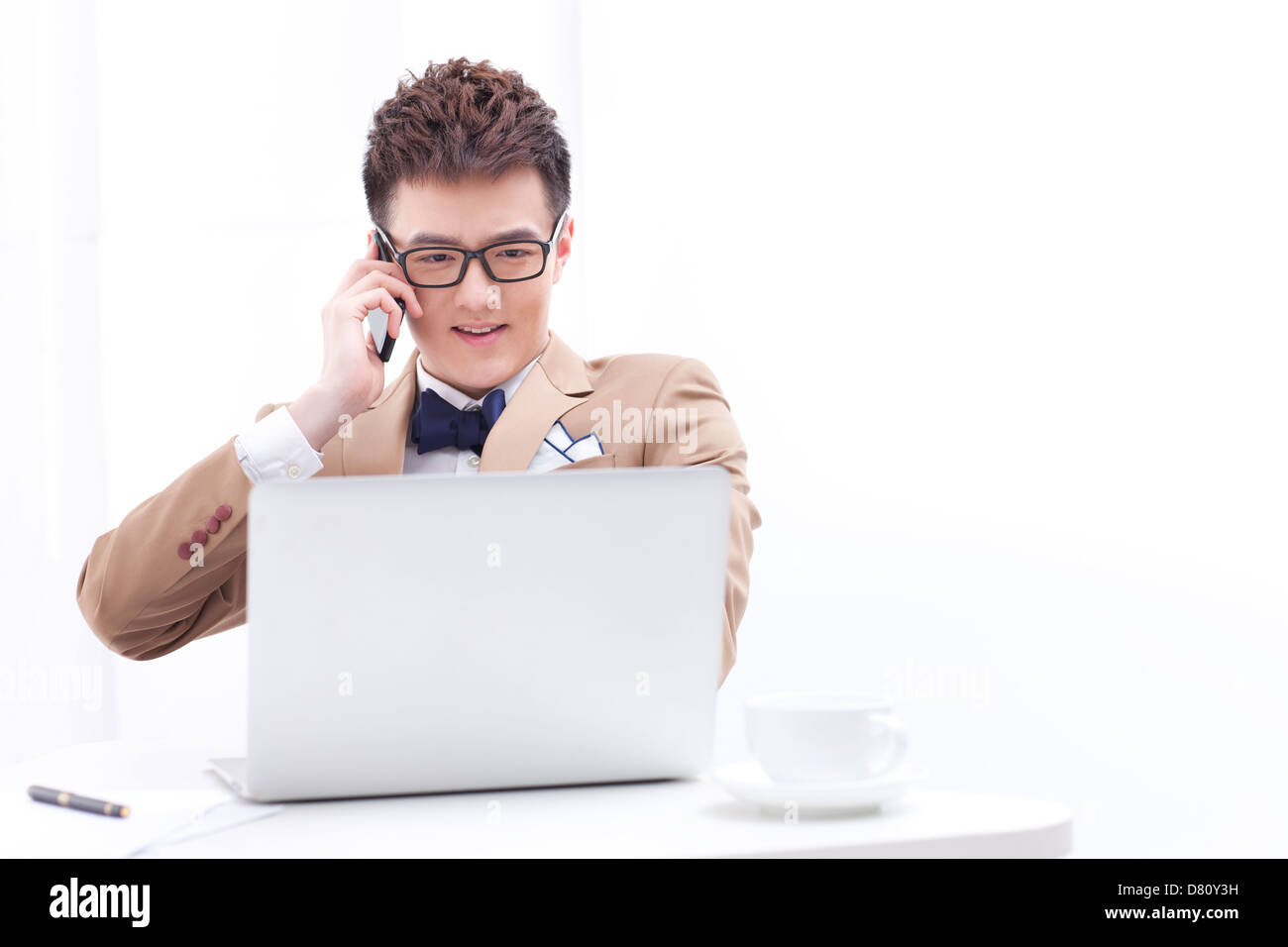Young man using computer in office Cut Out Stock Images & Pictures - Alamy