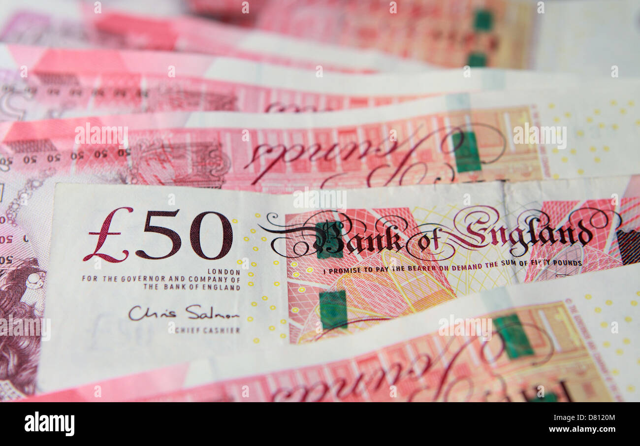 A £50 note amongst upside down £50 notes Stock Photo - Alamy
