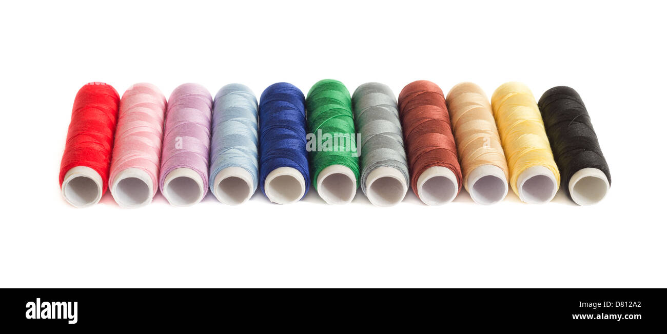 Colorful thread spools isolated on white background Stock Photo - Alamy