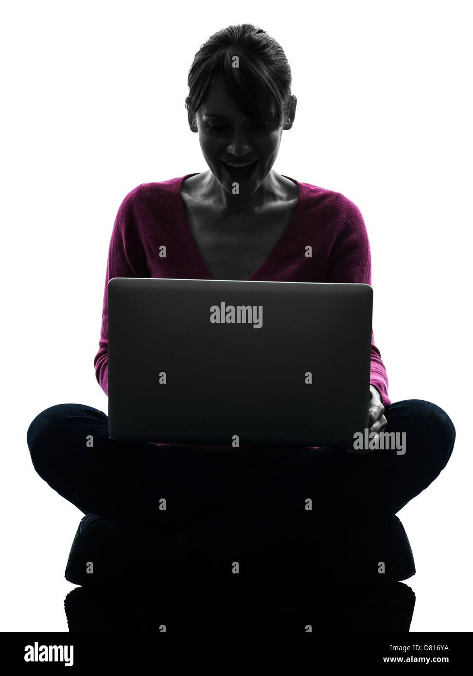 one woman happy smiling computing laptop computer in silhouette studio ...