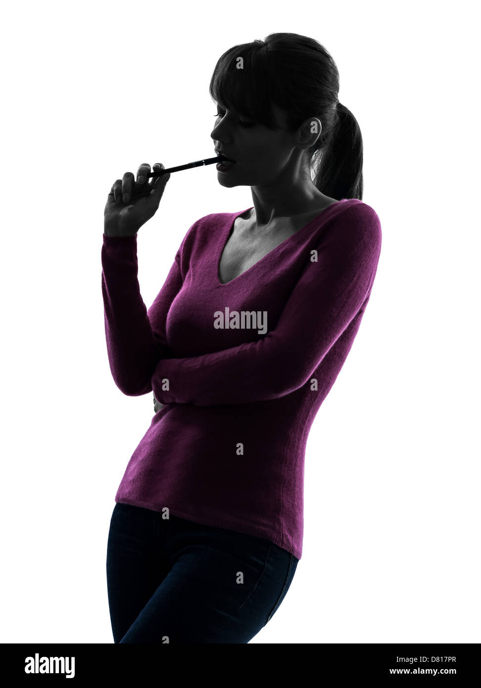 one woman thinking chewing pen in silhouette studio isolated on white ...