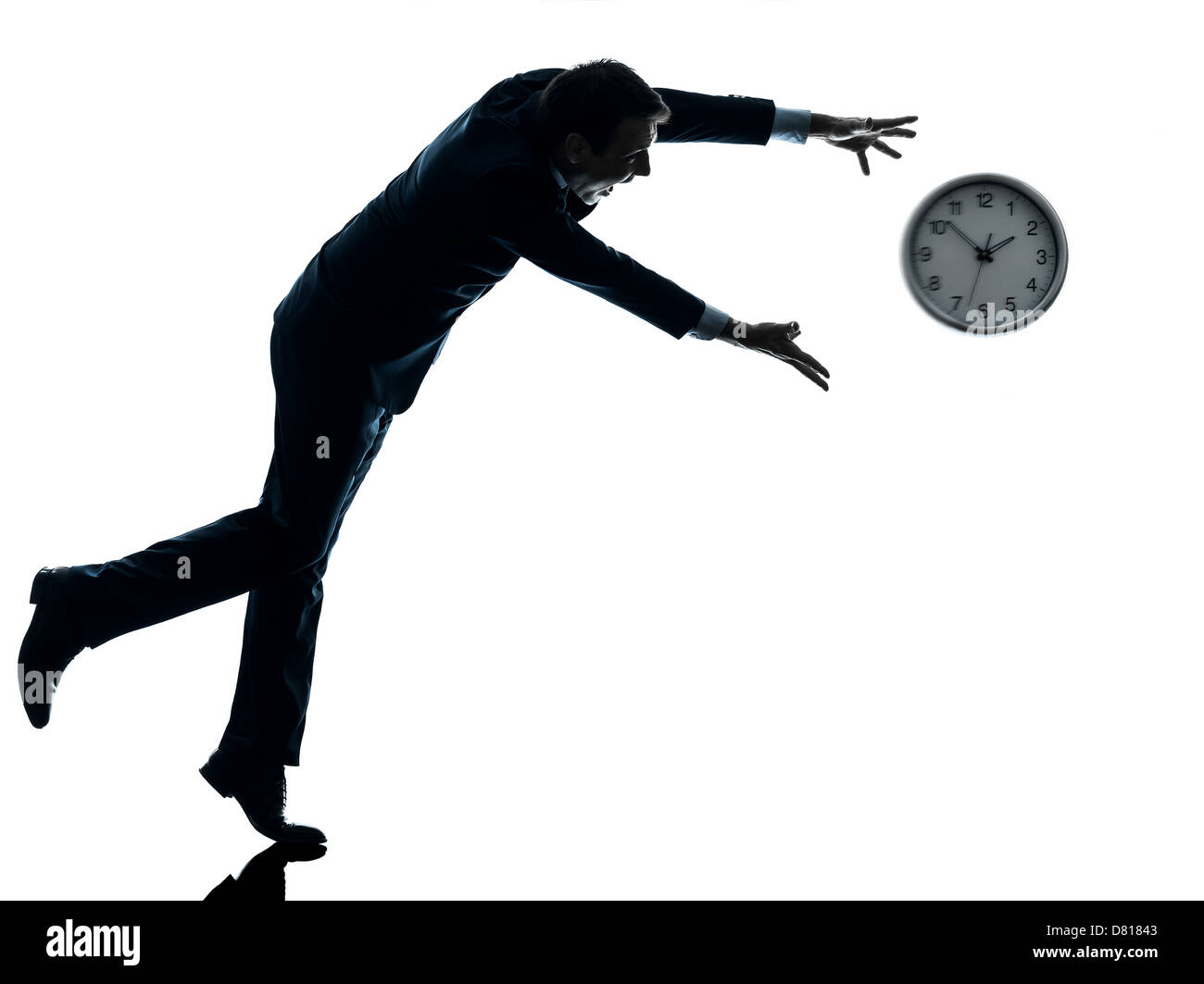 one businessman running after time in silhouette studio isolated on ...