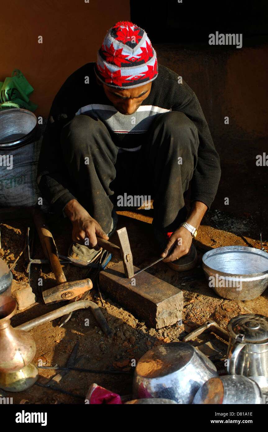 Nepal. People doing craft work on the side of the street in Phokara ...