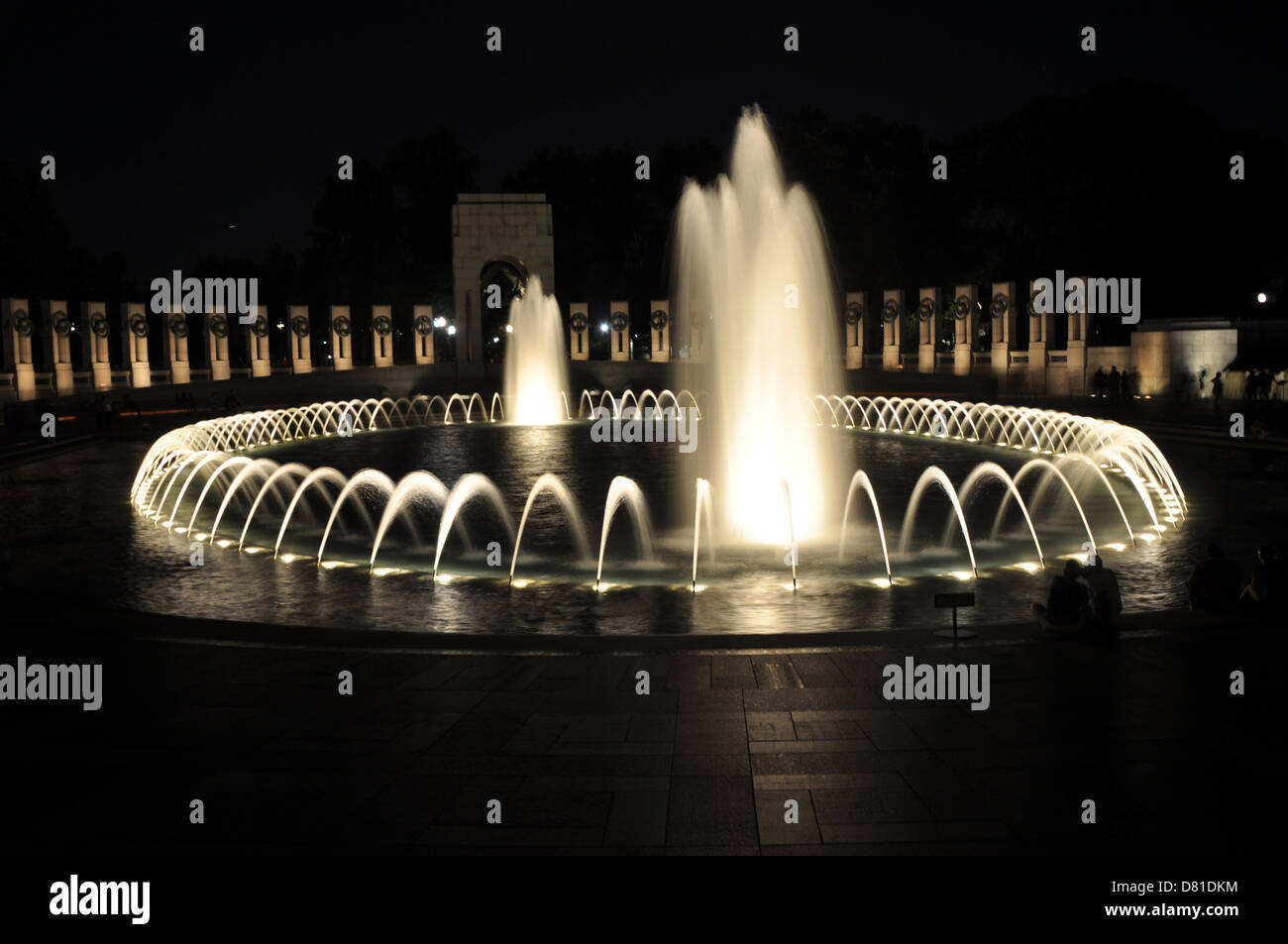World War II Memorial fountains seen illuminated at night. The memorial ...