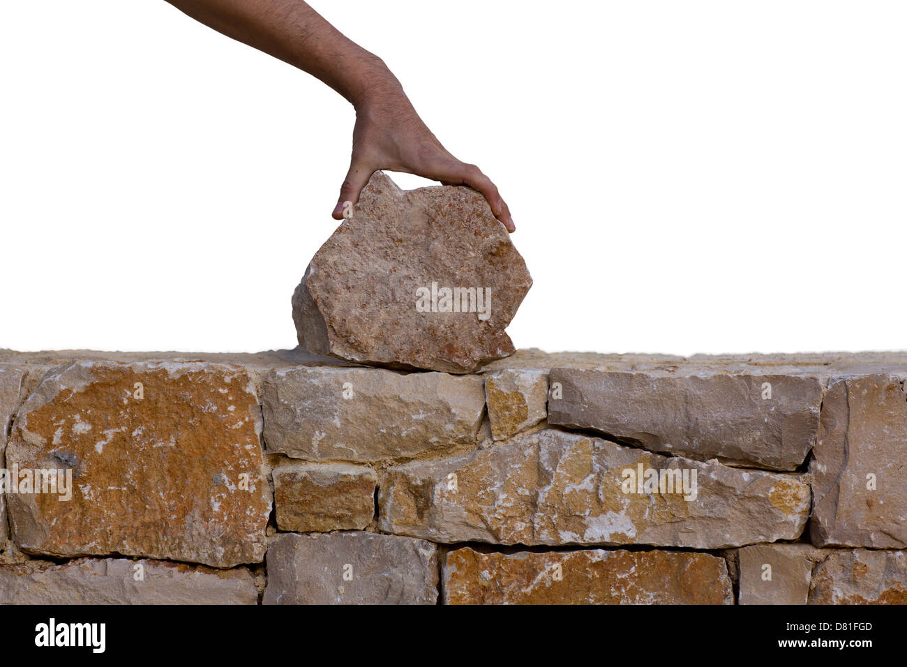 Mason hands working on masonry stone wall stonewall Stock Photo - Alamy