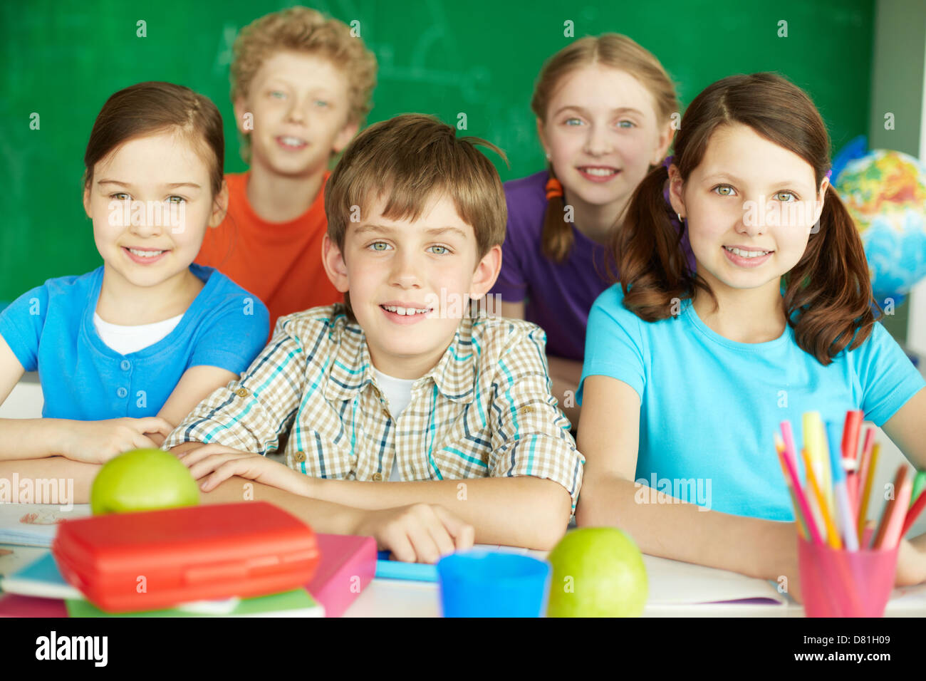 Portrait of cute schoolchildren looking at camera in classroom Stock ... Portrait of cute schoolchildren looking at camera in classroom Stock ...