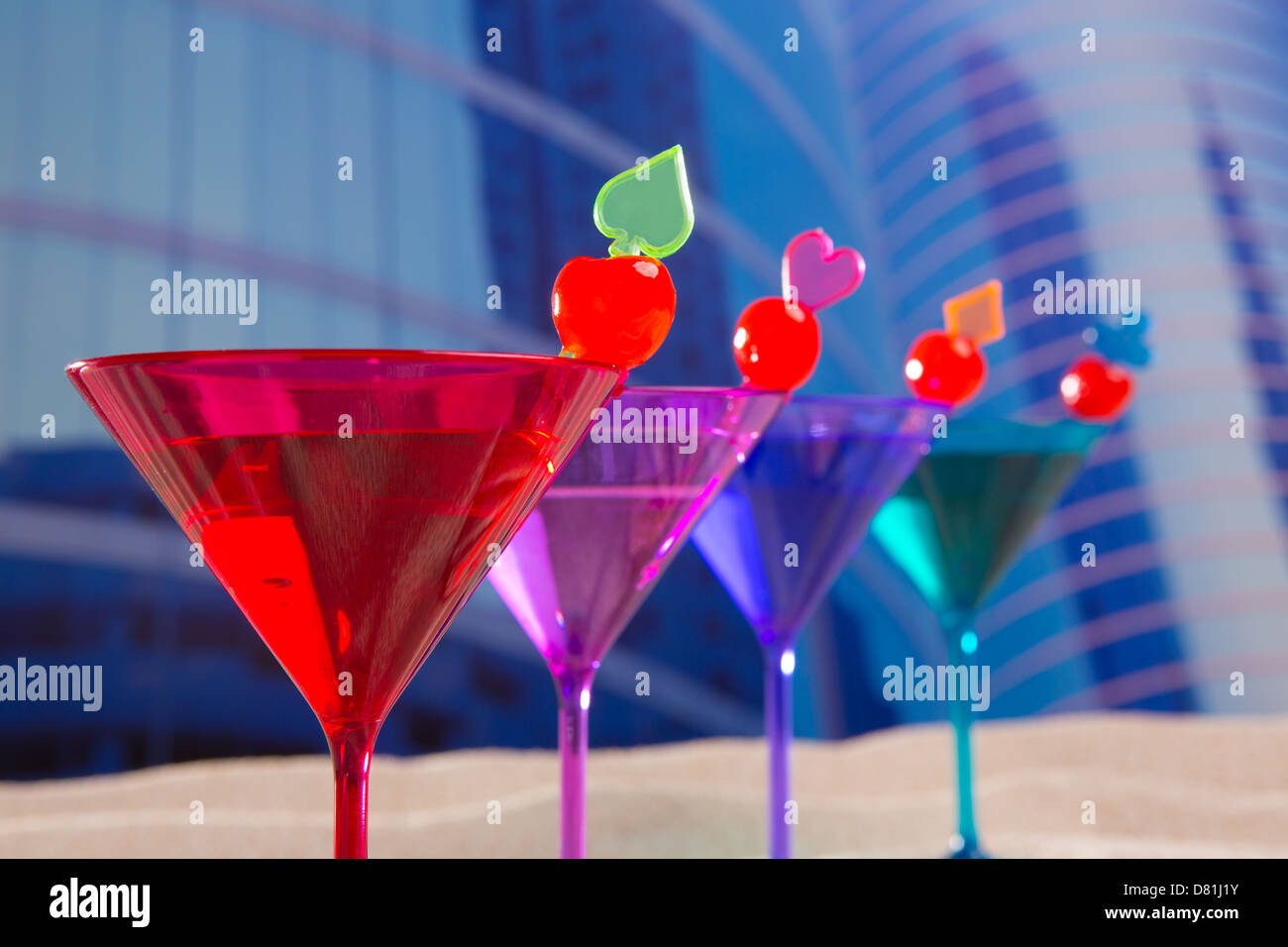 colorful cocktail in a row with cherry sand in urban city building ...