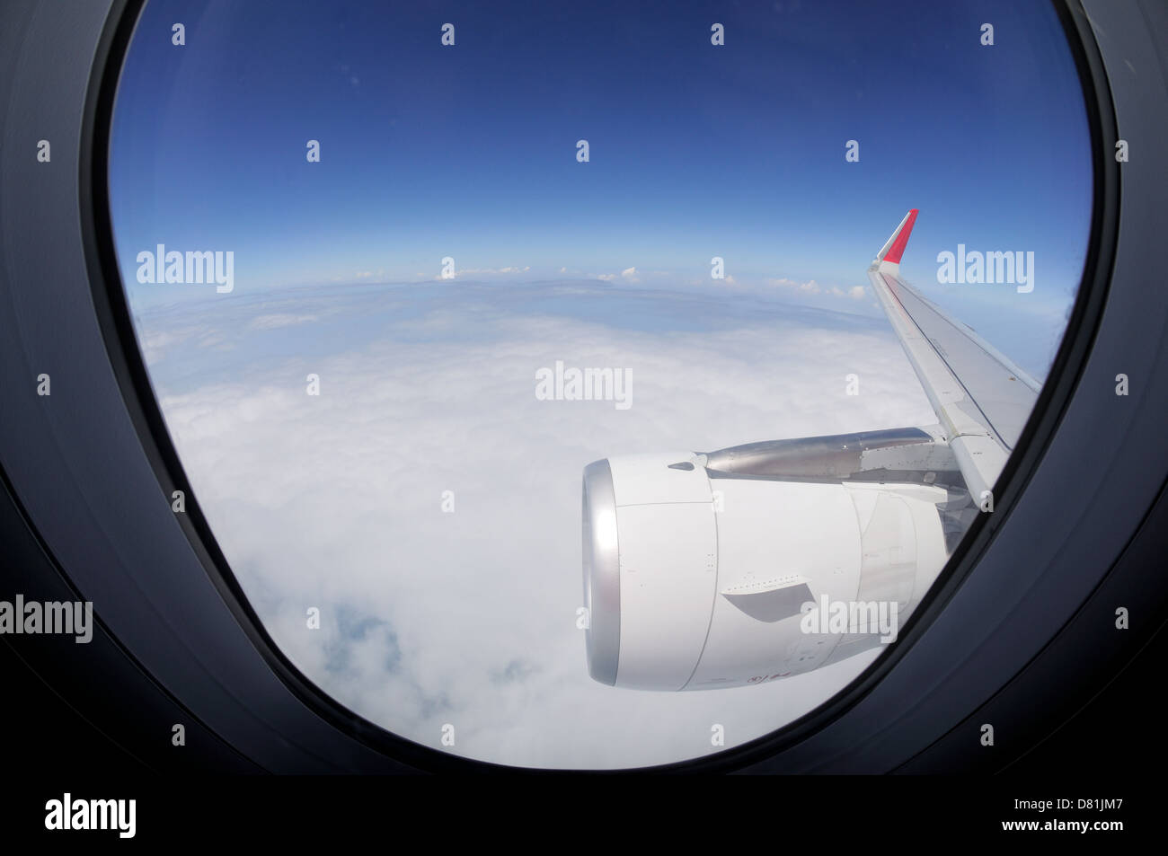 Clouds and sky as seen through window of an aircraft Stock Photo - Alamy