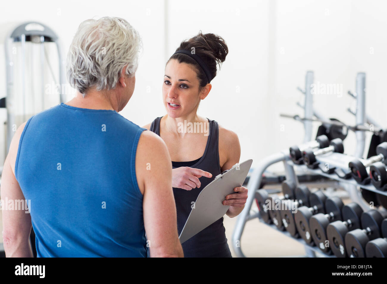 Mature woman with personal trainer hi-res stock photography and images ...