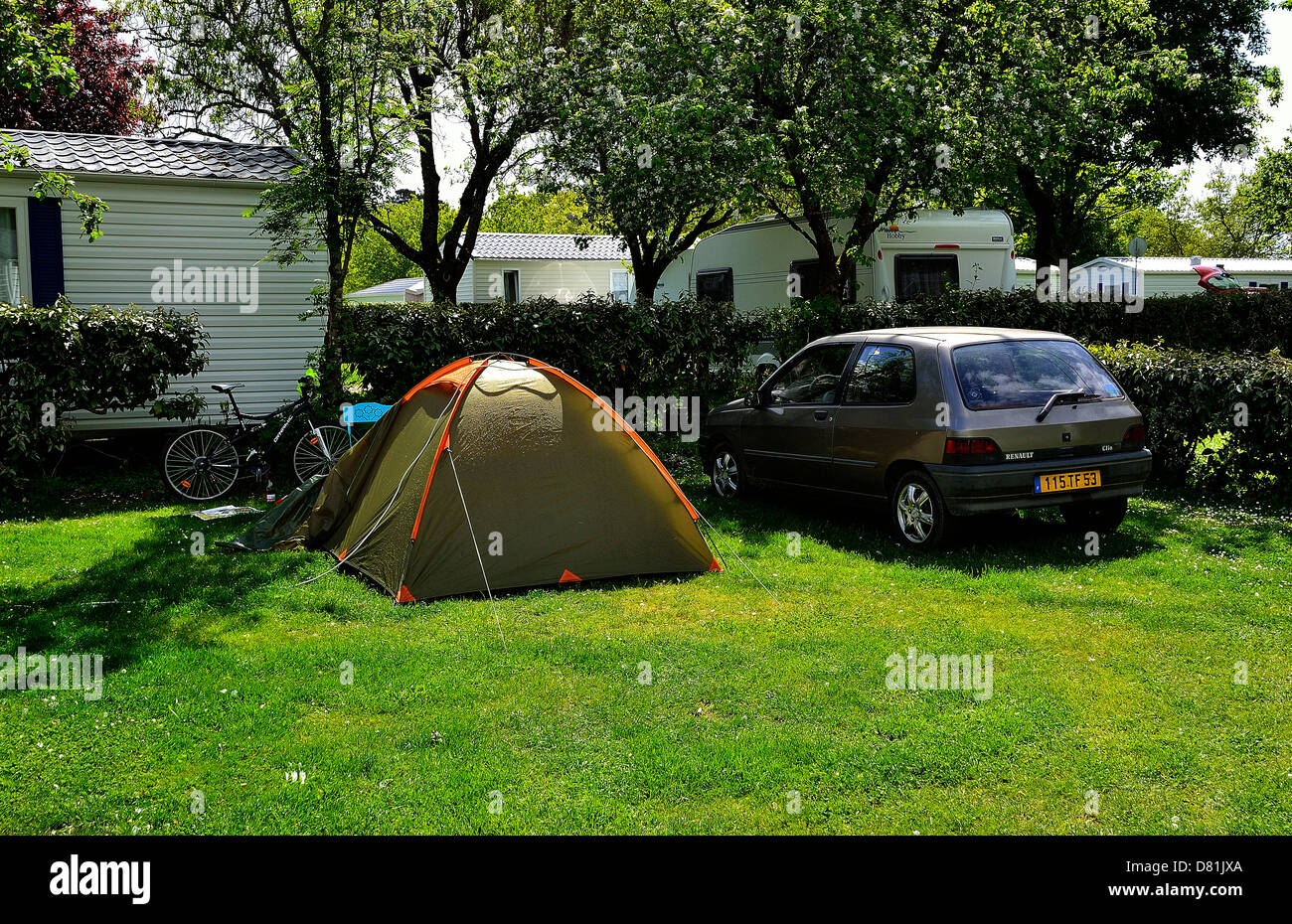 A car and a tent on a site in a camping (Brittany, France Stock Photo ...
