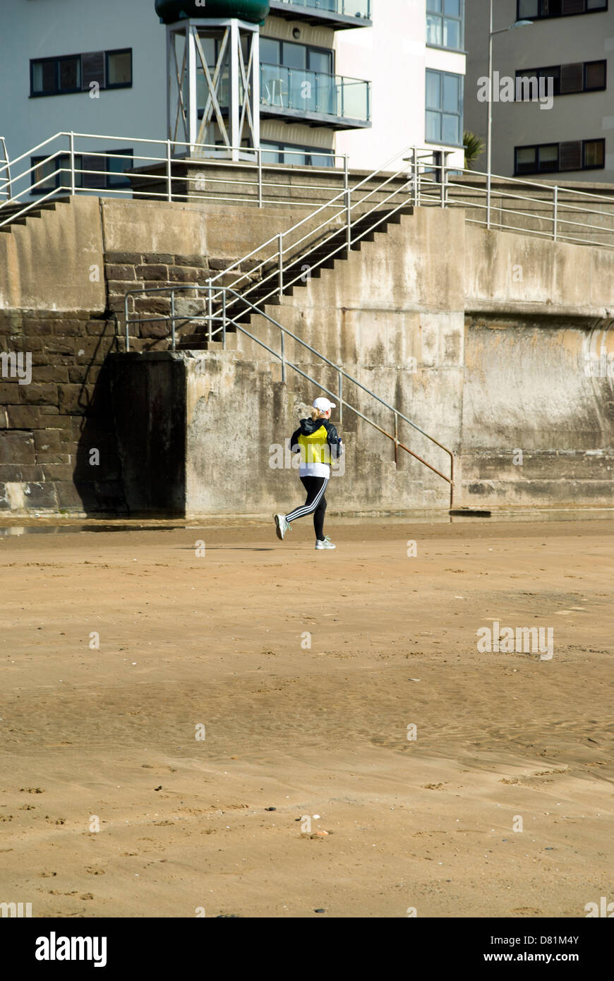 Woman running beach beach hi-res stock photography and images - Alamy