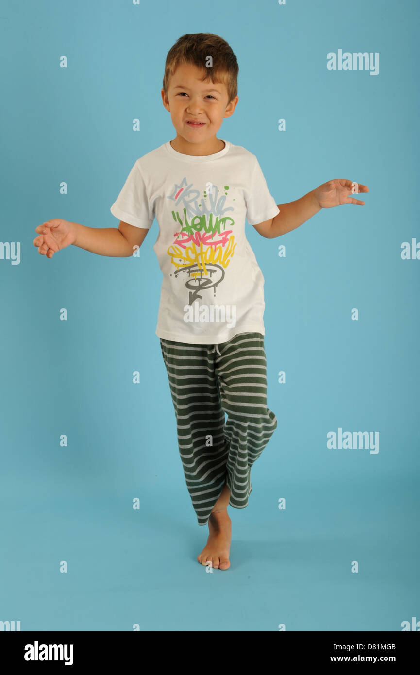 Boy balancing on one foot Stock Photo - Alamy