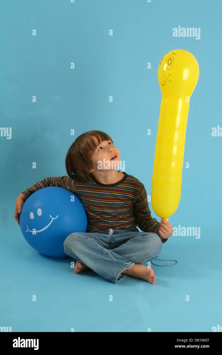 Boy with balloons Stock Photo - Alamy