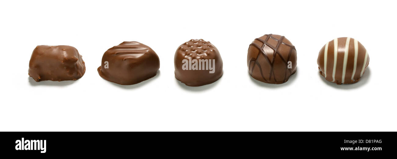 row of chocolates cut out onto a white background Stock Photo - Alamy