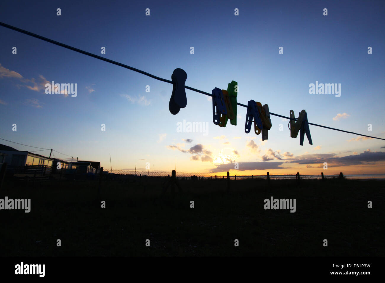 pegs on washing line Stock Photo - Alamy