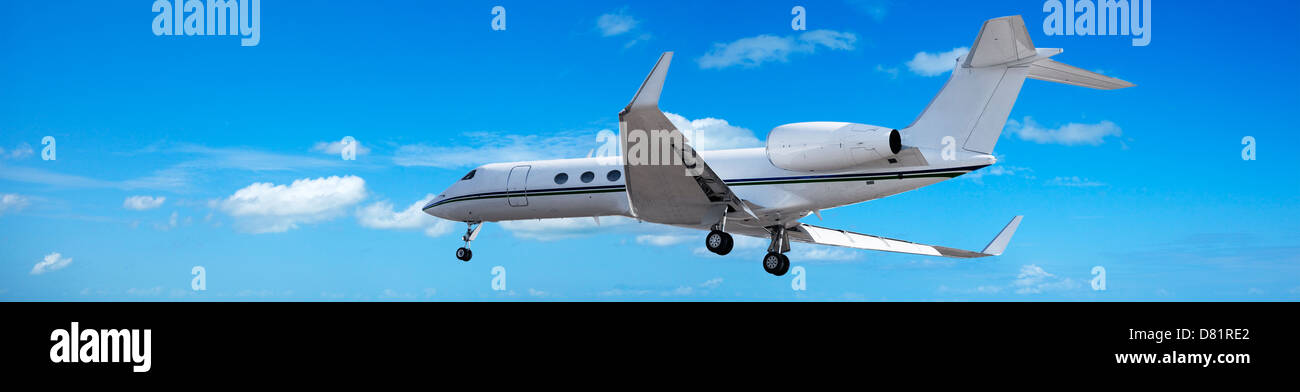 Private jet maneuvering in a blue sky. Panoramic composition Stock ...
