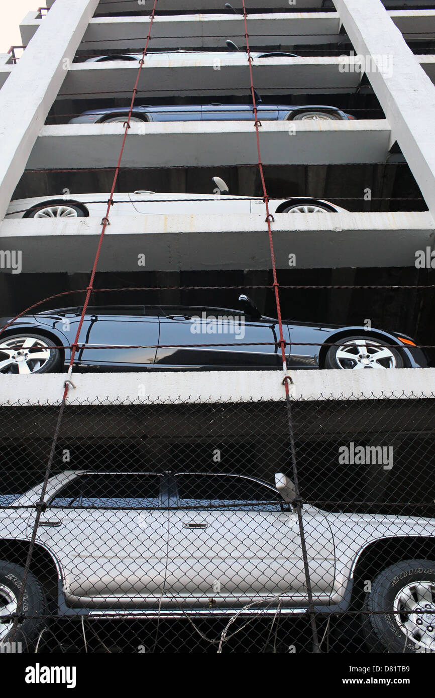 Staked cars in car park Stock Photo - Alamy