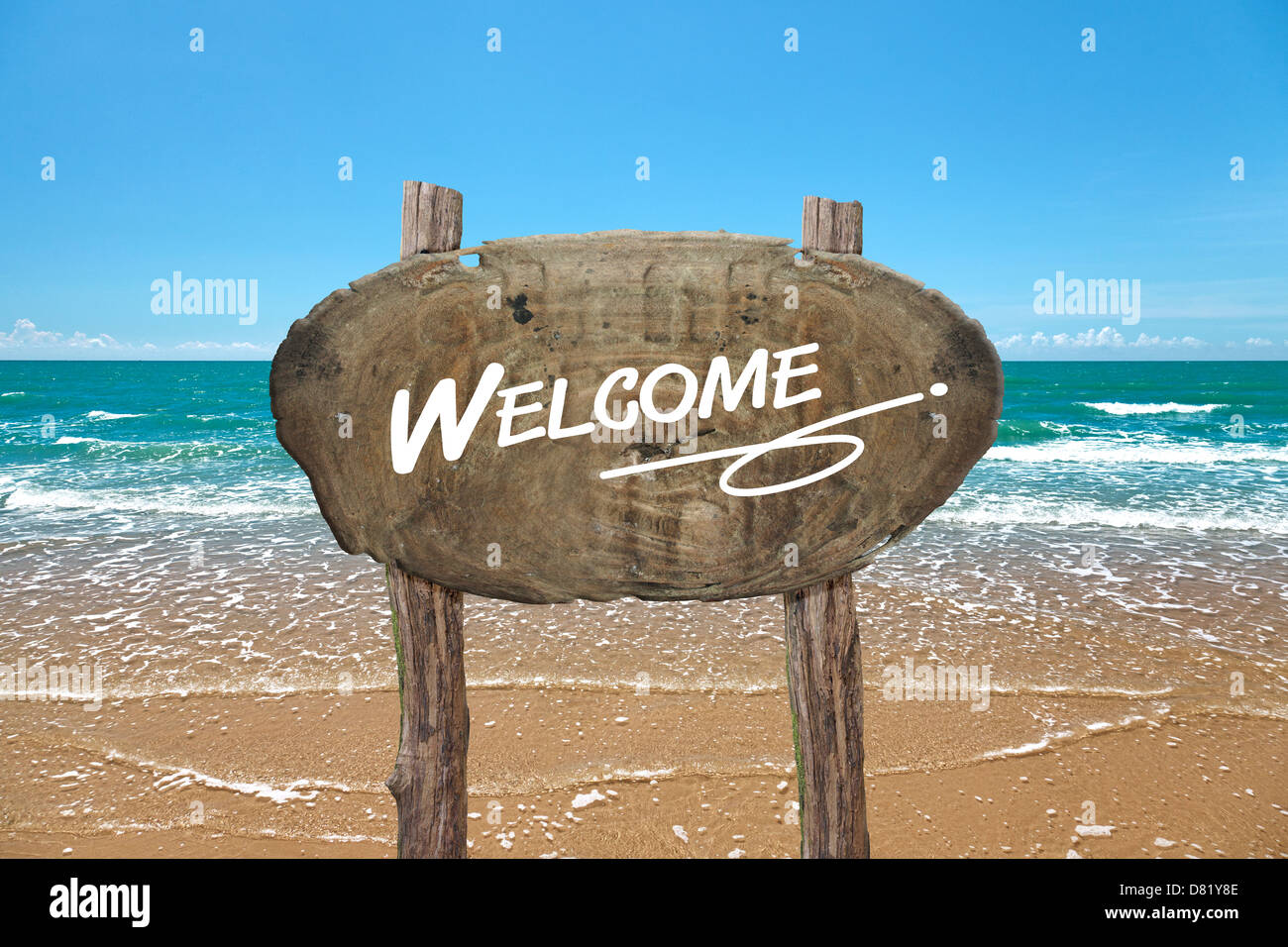 WELCOME, wooden signboard on tropical beach Stock Photo - Alamy